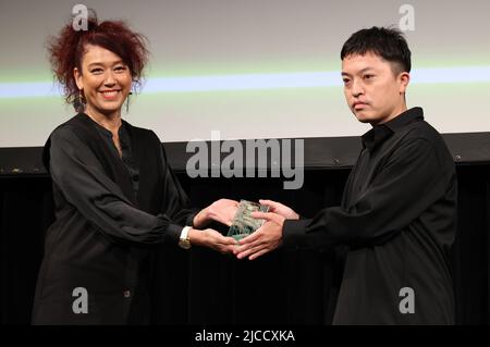 (L-R) Japanese film director Kensaku Kakimoto, Japanese actress Yuumi ...