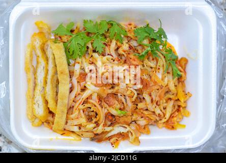 Myanmar traditional or classic white flat noodle salad called Khauk Swe ...