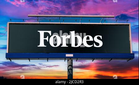Advertisement billboard displaying logo of Forbes Stock Photo - Alamy
