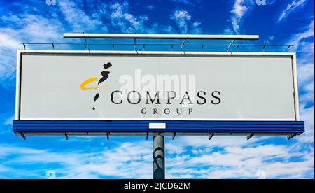 Advertisement billboard displaying logo of Compass Group Stock Photo ...