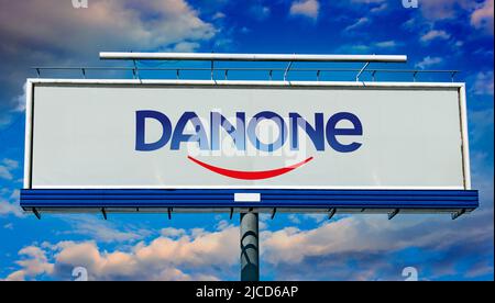 Advertisement billboard displaying logo of Danone Stock Photo - Alamy