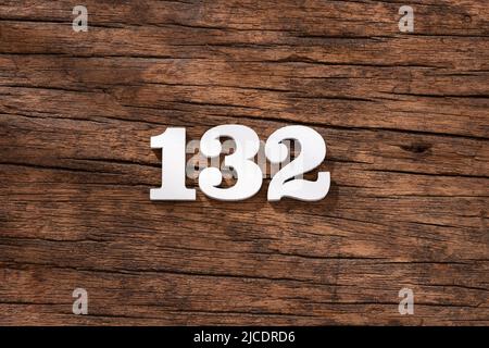Number 132 in wood, isolated on white background Stock Photo - Alamy