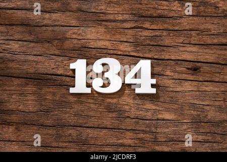 Number 134 in wood, isolated on white background Stock Photo - Alamy