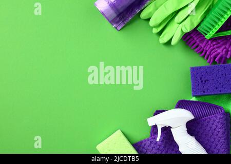 Top view of house cleaning supplies: rubber gloves, sponges, cloths ...