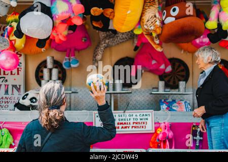 The Cans and Ball of a Throwing Prize Fun Fair Game Stock Photo - Alamy