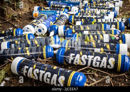 Large cans of "Fastgas" Nitrous Oxide (N2O) left discarded on a street ...
