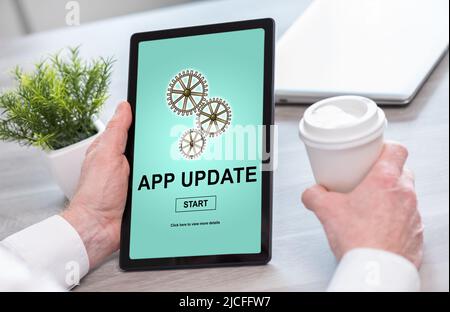 Tablet screen displaying an application update concept Stock Photo - Alamy