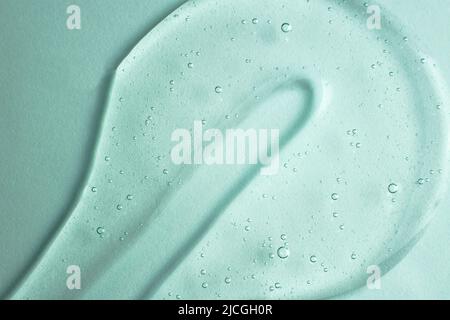 Green transparent gel texture filled with air bubbles. Development of ...