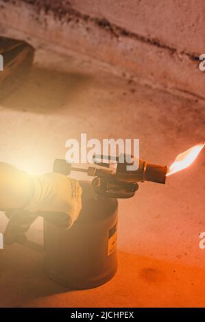 Gasoline blowtorch with a burning fire, the use of a blowtorch in ...