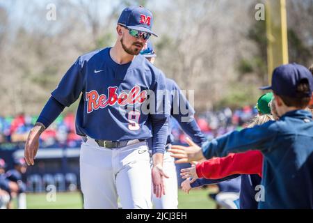 March 13, 2022: Ole Miss catcher Hayden Dunhurst (13) takes a swing ...