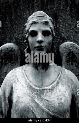 Cemetery statues edited in black and white Stock Photo - Alamy