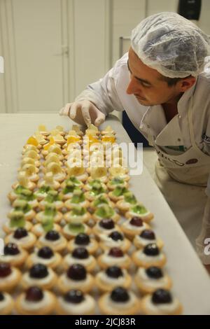 ISTANBUL, TURKEY - AUGUST 10: Turkish chefs making unbaked cookies in ...