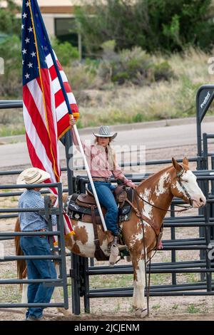 Rodeo in Colorado Springs, Colorado starts with the National Anthem and ...