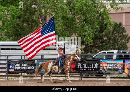 Rodeo in Colorado Springs, Colorado starts with the National Anthem and ...