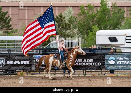 Rodeo in Colorado Springs, Colorado starts with the National Anthem and ...