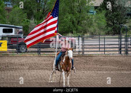 Rodeo in Colorado Springs, Colorado starts with the National Anthem and ...