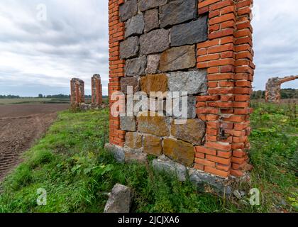 landscape with stone and brick barn ruins, old stone foundations ...
