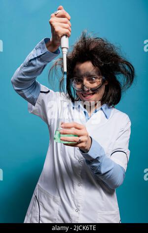 Laboratory worker using pipette, dripping liquid into petri dish Stock ...