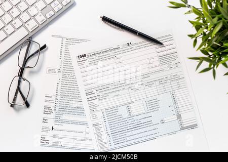 Tax form under US law with culculator on office table desktop Stock ...