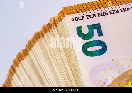 Large stack of 50 euro banknotes, European Union currency, on white ...