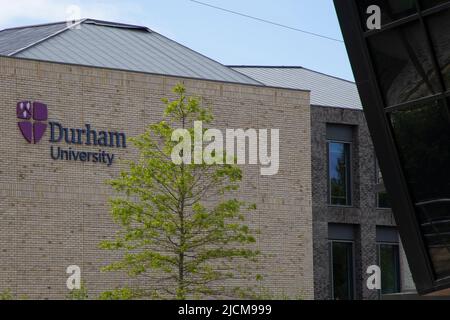 The logo of Durham University on a building within the Durham city ...