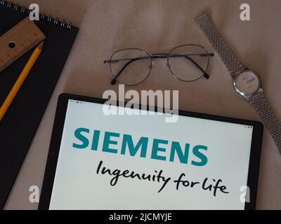 In this photo illustration Siemens Group logo seen displayed on a ...