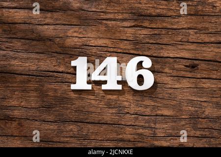 Number 146 in wood, isolated on white background Stock Photo - Alamy