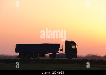 Dump truck in quarry, tipping load of stones Stock Photo - Alamy