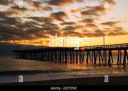 A beautiful sunrise paints the sky over Tangdao Bay in Qingdao City ...