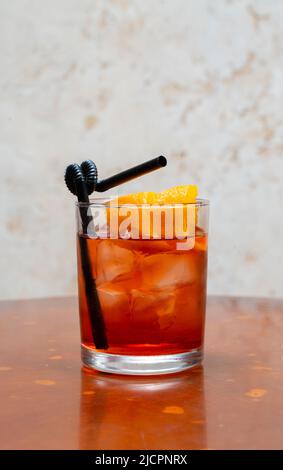Boulevardier cocktail and orange zest on rusty background Stock Photo ...