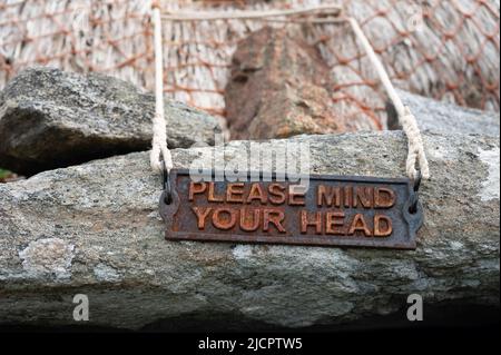 Please mind your head warning sign Stock Photo - Alamy