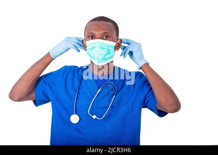 Young doctor wearing medical uniform over isolated background shouting ...