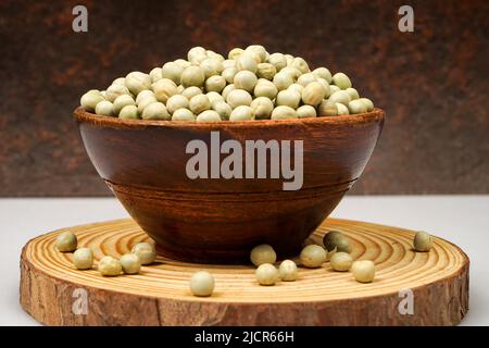 Uncooked dried green peas, also known as vatane in Marathi. in a ...