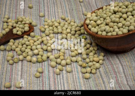 Uncooked dried green peas, also known as vatane in Marathi. in a ...