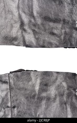 Two pieces of black leather with a space for text isolated on white ...