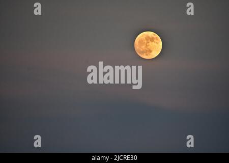 Strawberry full moon in Marseille, France Stock Photo - Alamy