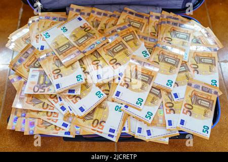 Suitcase full of Euro bills Stock Photo - Alamy