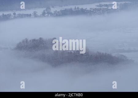 Brianza covered in fresh snow and fog in the early morning, near the ...