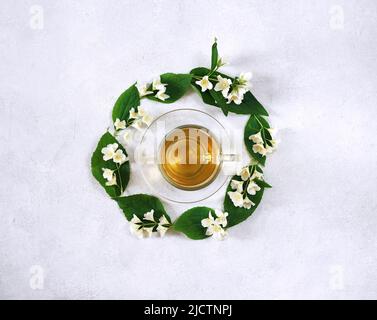 A closeup view of tea with a yellow flower Stock Photo - Alamy