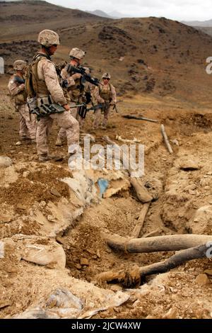 Marines with 1st Battalion, 8th Marines stand by on the firing line ...