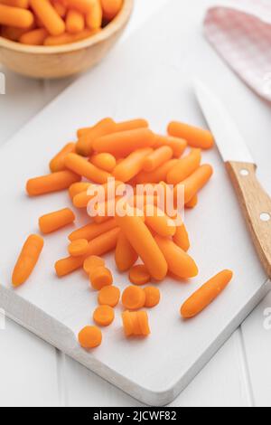 Baby carrot vegetable. Mini orange carrots isolated on white background ...