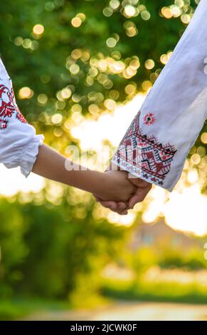 Ukrainian grandmother and granddaughter in vyshyvanka. selective focus ...