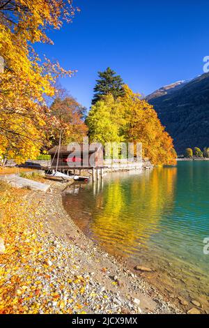 Lake House in Autumn Reflecting in Tranquil River Stock Photo - Alamy