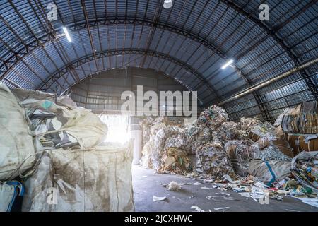 Waste paper sorting and filing for processing at paper recycling plant ...