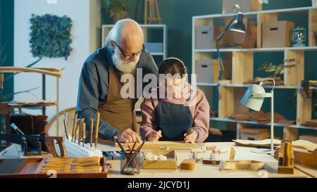Grandfather Carpenter with Granddaughter Work with Wood to Create Items ...