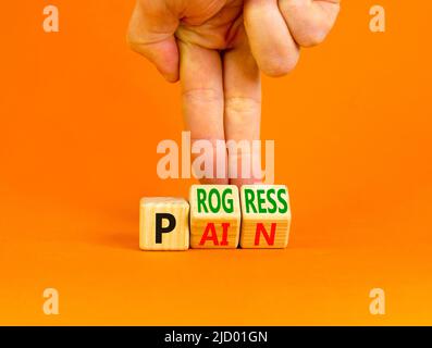 Pain or progress symbol. Concept words Pain or Progress on wooden cubes ...