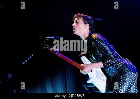 Live music event of artist Clark with bright white lights illuminating ...