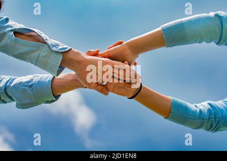 Concept of teamwork and unity with palms one on one in pile Stock Photo ...