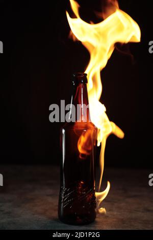 Beer bottle in fire and flame Stock Photo - Alamy