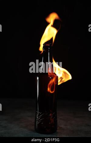 Mixing dark beer with light in one mug by tapping it from a tap ...